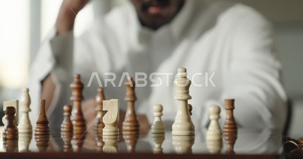 Close-up depiction of the hand of a Saudi Arabian Gulf man playing ...