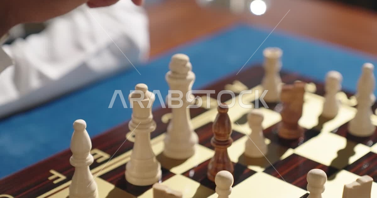 Close-up depiction of the hand of a Saudi Arabian Gulf man playing ...