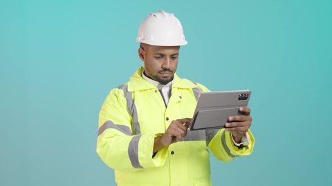 A portrait of a Saudi Gulf Arab engineer wearing traditional attire and ...