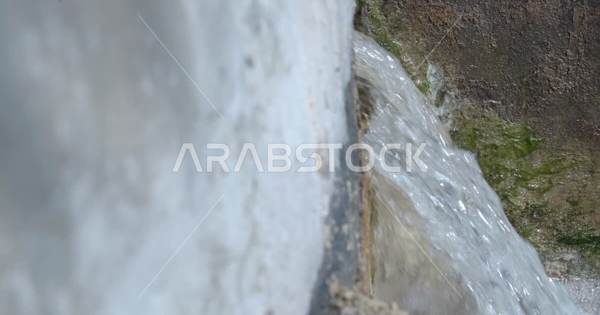 Close-up depiction of groundwater flow from the ground, pure and ...