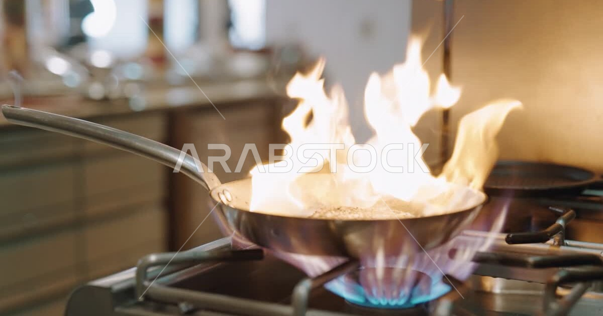 A Saudi Arabian Gulf cook prepares food to be served in the restaurant ...
