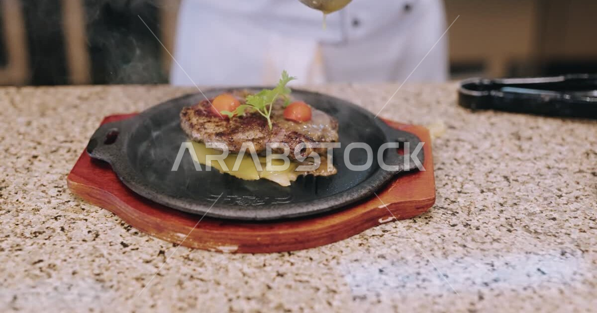 A Saudi Arabian Gulf cook prepares food to be served in the restaurant ...