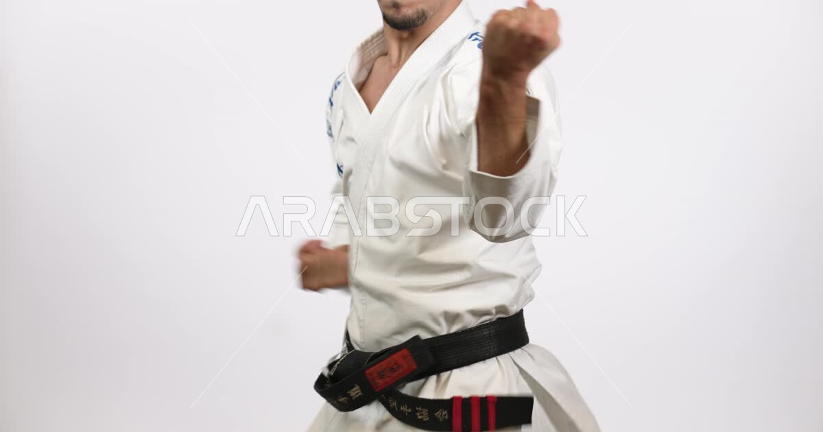 Portrait of a Saudi Arabian Gulf Arab man wearing a Japanese karate ...