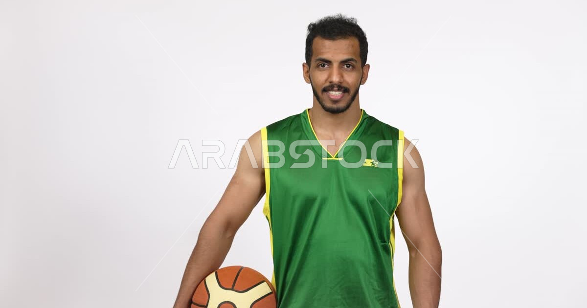 Portrait of a happy Saudi Arabian Gulf Arab man wearing a sports ...