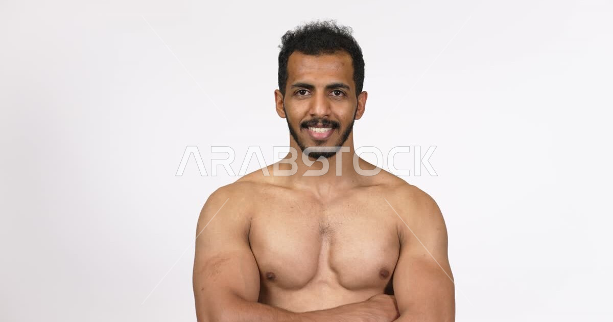 Portrait of a Saudi Arabian Gulf Arab man, a happy boxer, wearing ...