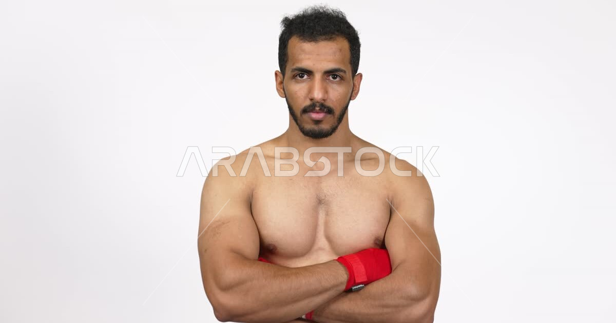 Portrait of a Saudi Arabian Gulf Arab man, a happy boxer, wearing ...