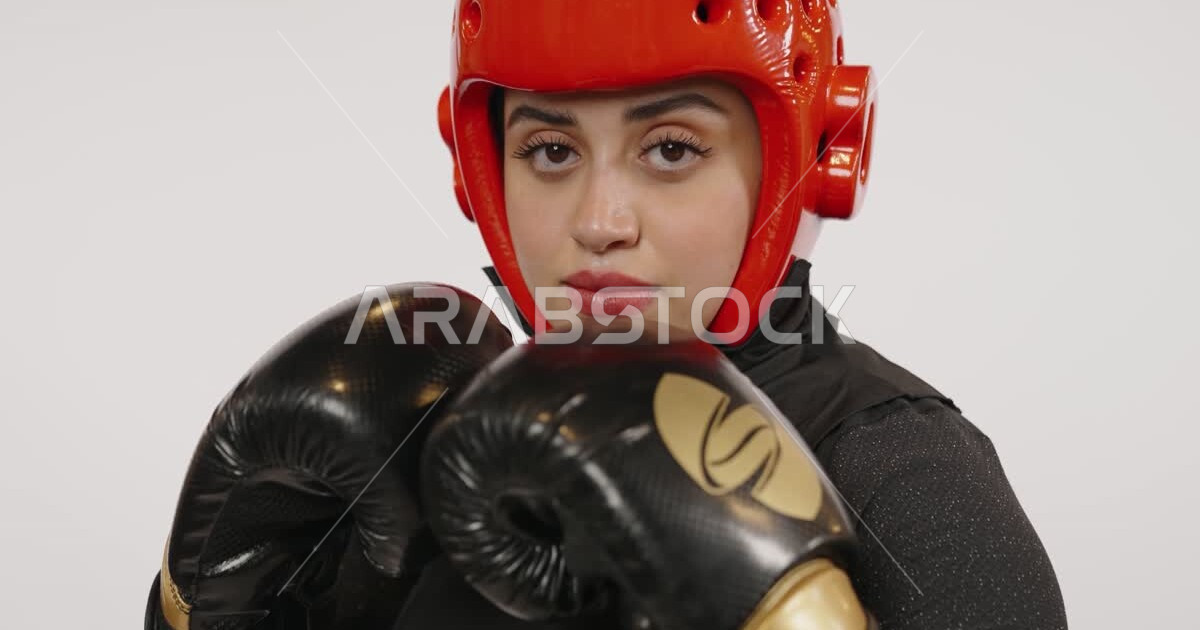 Portrait of a veiled Saudi Arabian Gulf woman in the women's boxing ...