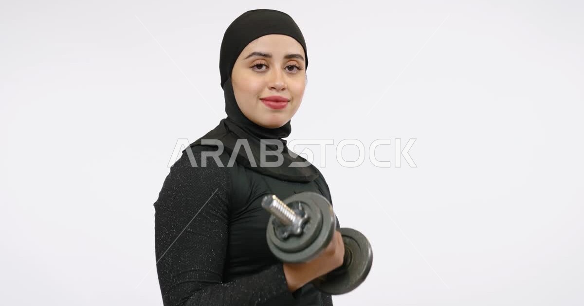 Portrait of a veiled Saudi Arabian woman wearing a sportswear ...