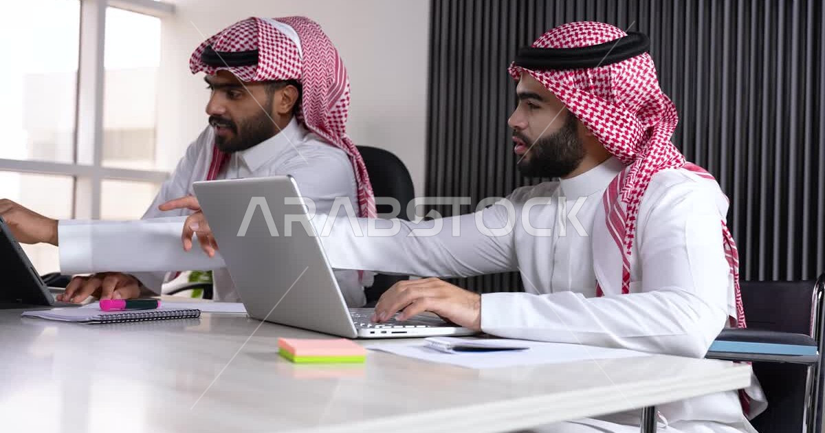 A Saudi Arabian Gulf employee of people of determination working on a ...