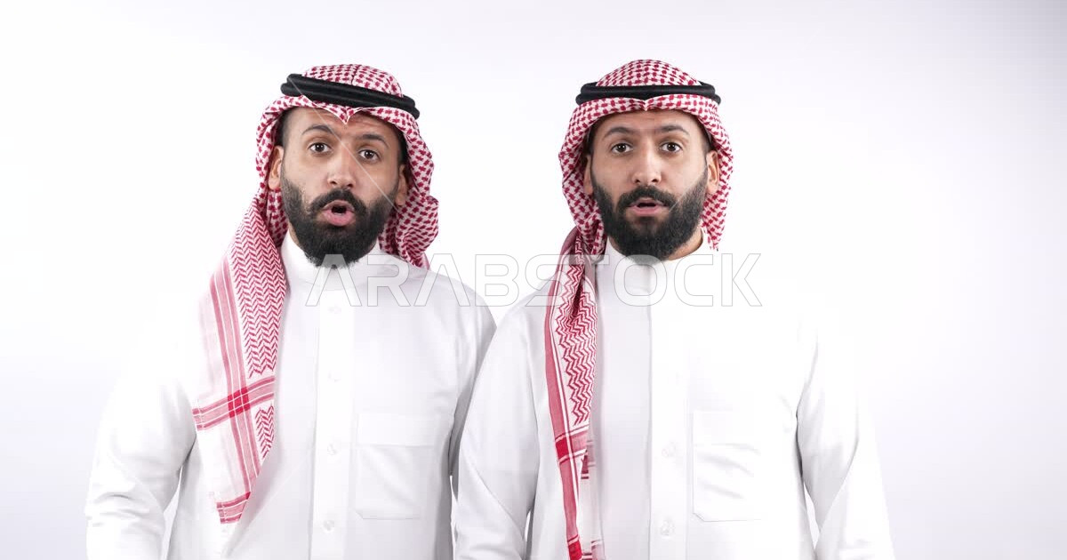 Portrait of two Saudi Arabian Gulf twin men, do not disturb, stop ...