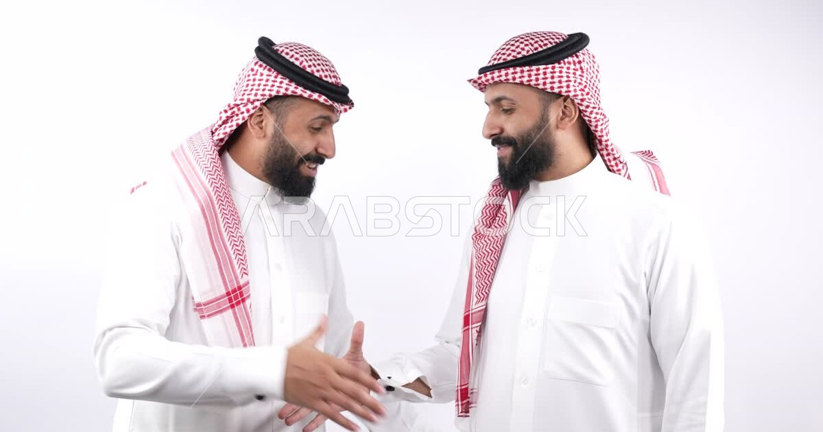 Portrait of two Saudi Arabian Gulf twin men, interconnected brotherly ...