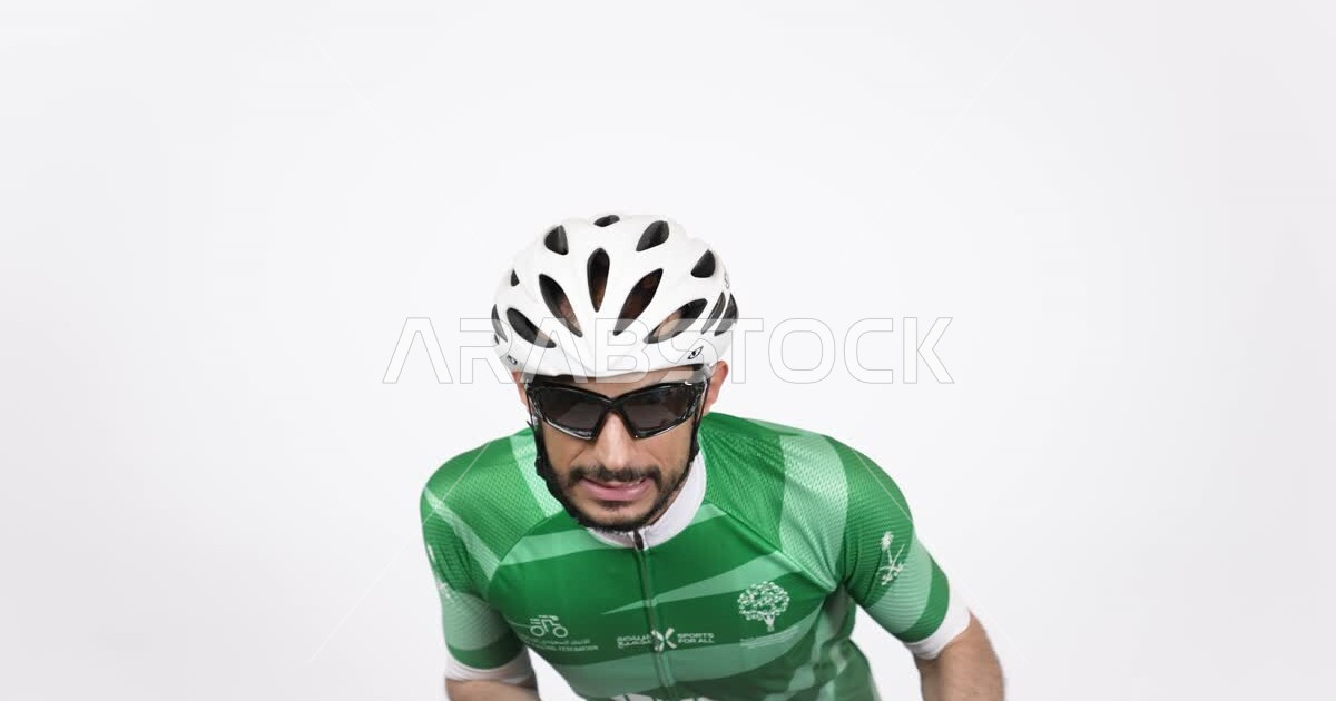 Portrait of a Saudi Arabian Gulf Arab man wearing a motorcycle racing ...