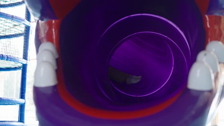 A Gulf Arab Saudi man dressed in casual attire holds a bowling ball ...