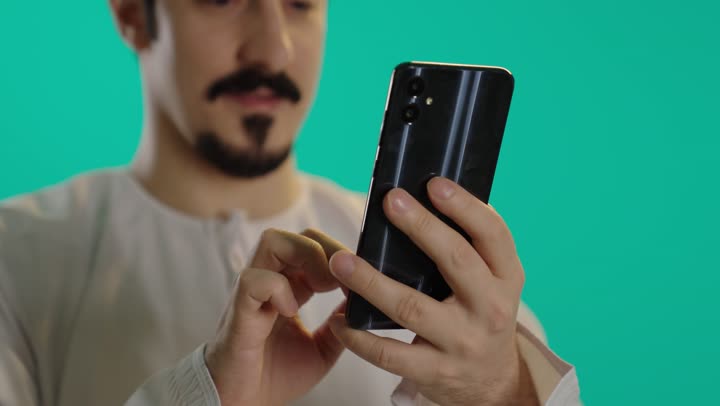 Carrying out the daily required tasks with passion, an Arab Gulf Omani ...