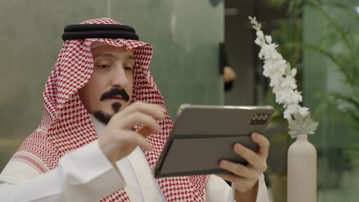 Project management professionally using a tablet, a comfortable office ...