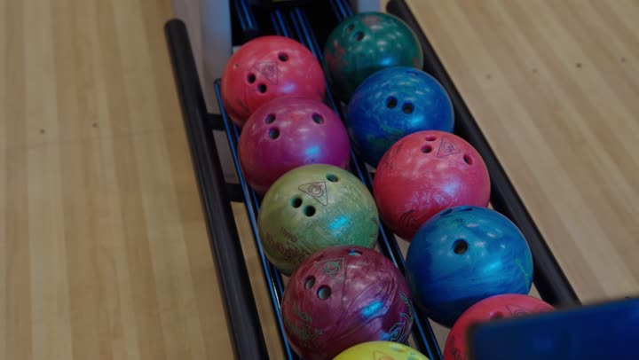A small Arab Saudi Gulf child wearing casual attire looks happily at ...