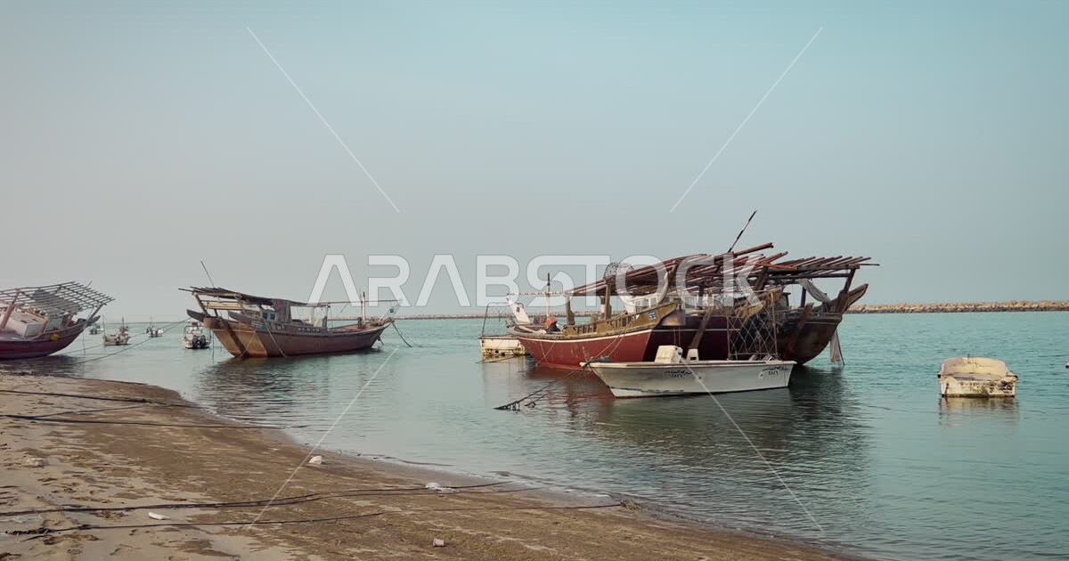 A depiction of an old heritage boat on a beach in the Kingdom of Saudi ...