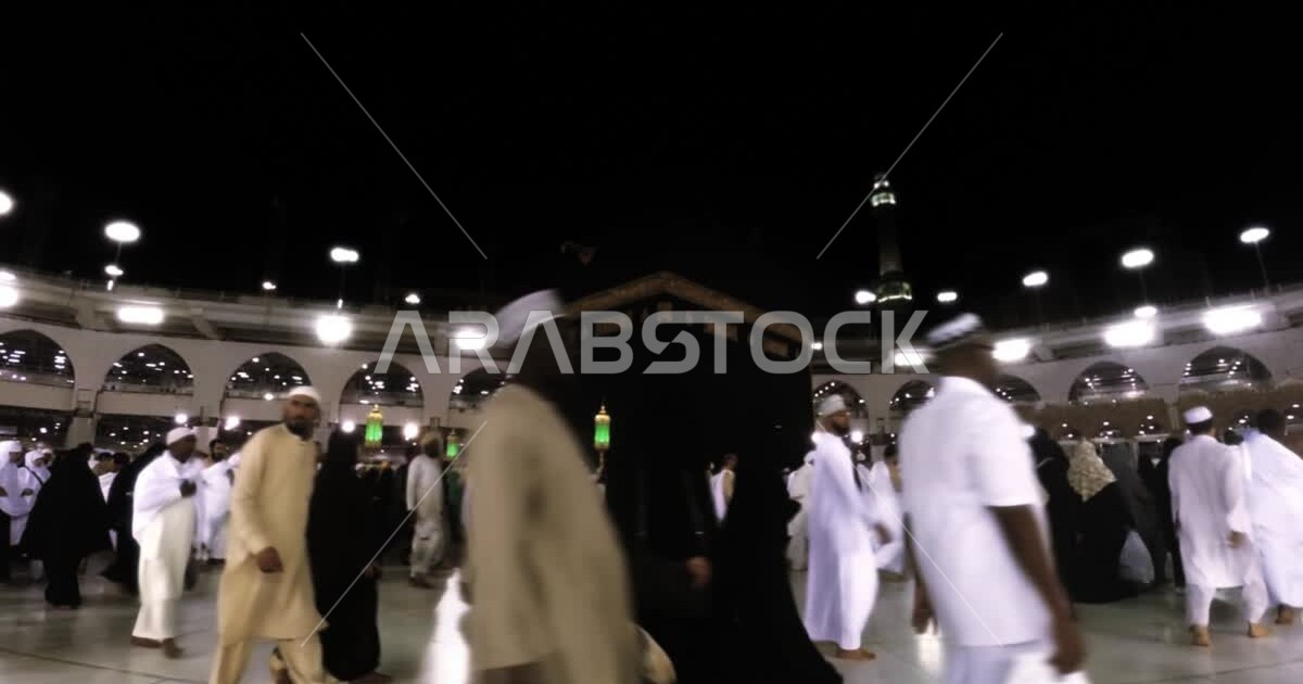 Muslim pilgrims in Ihram dress performing Hajj, performing the rituals ...