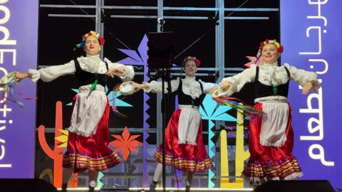 A Mexican folk dance performance at a food festival in the outdoor ...