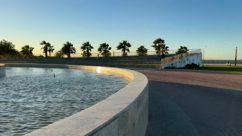 A coastal promenade with outdoor seating, the waterfront in Dammam city ...