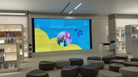 Reading area inside a modern library, digital display screen ...