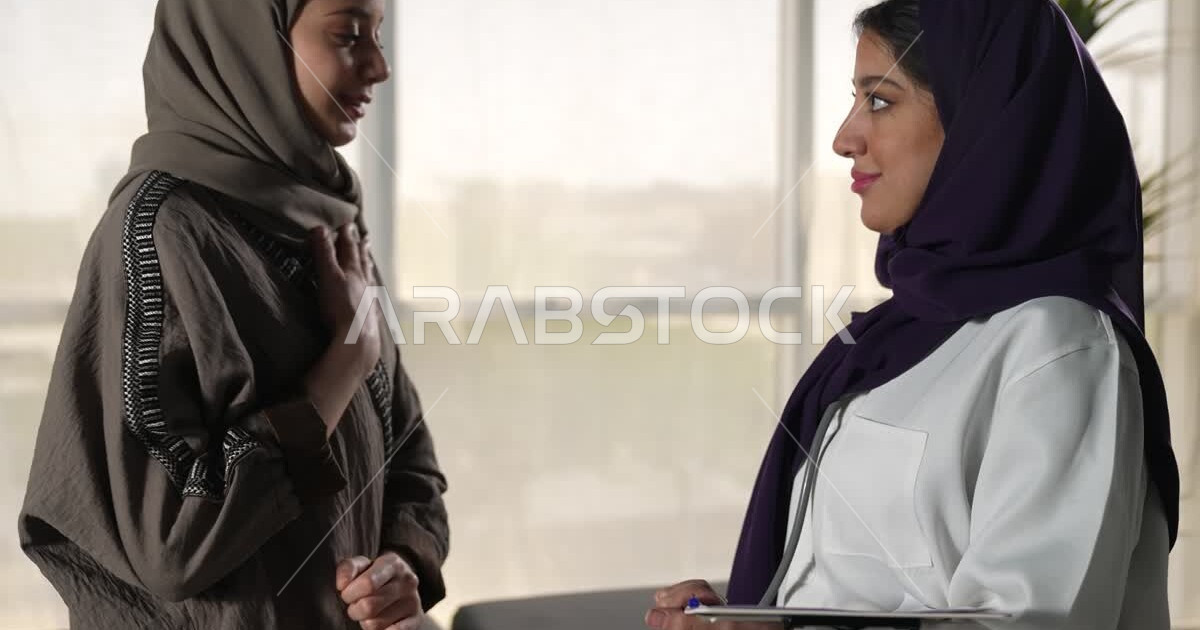 A Saudi Arabian Gulf doctor examines a patient, an appointment with a ...
