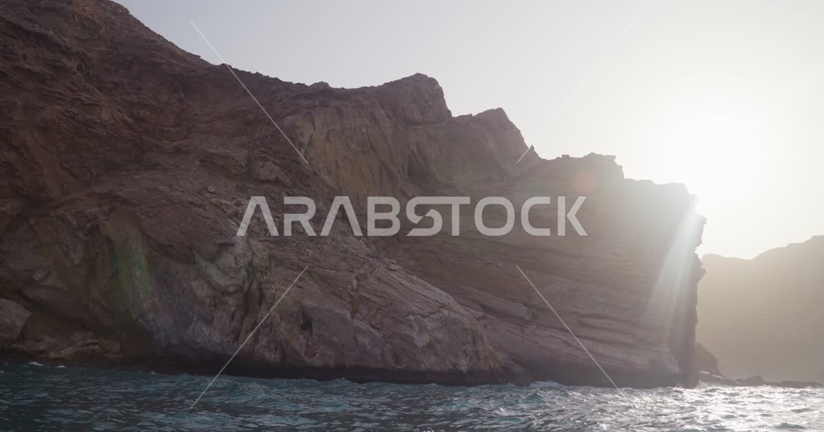 The Gulf of Oman between the sea and the mountain at sunset, the marine ...