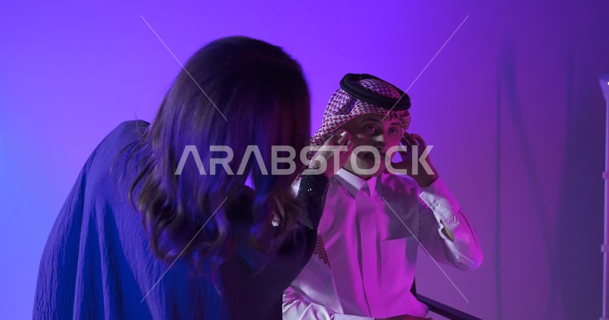 A photo session for a Saudi Arabian Gulf man, taking photographs ...