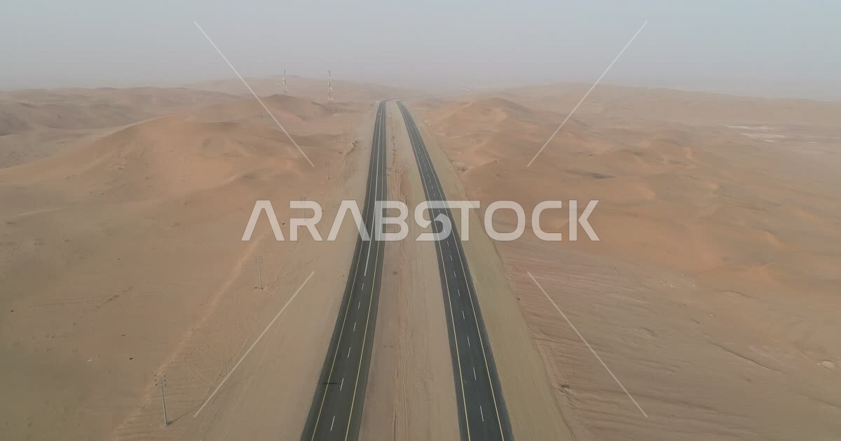 Drone photography from above of the highway in the middle of the desert ...
