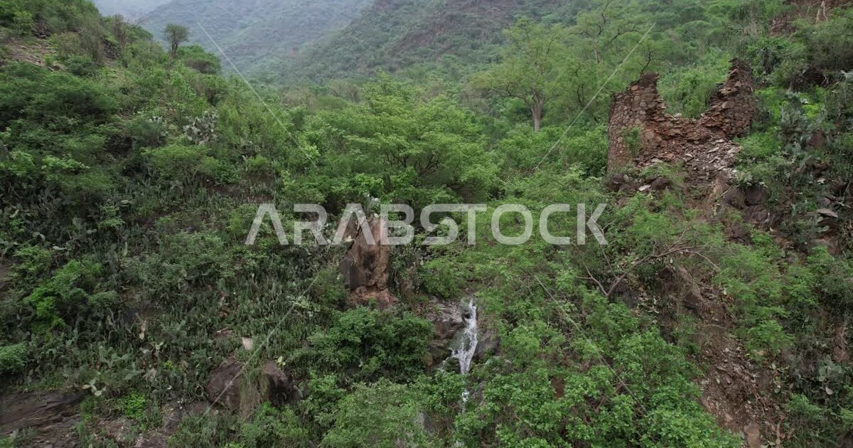 The beauty of nature and waterfalls in the Rijal Alma Mountains in Asir ...