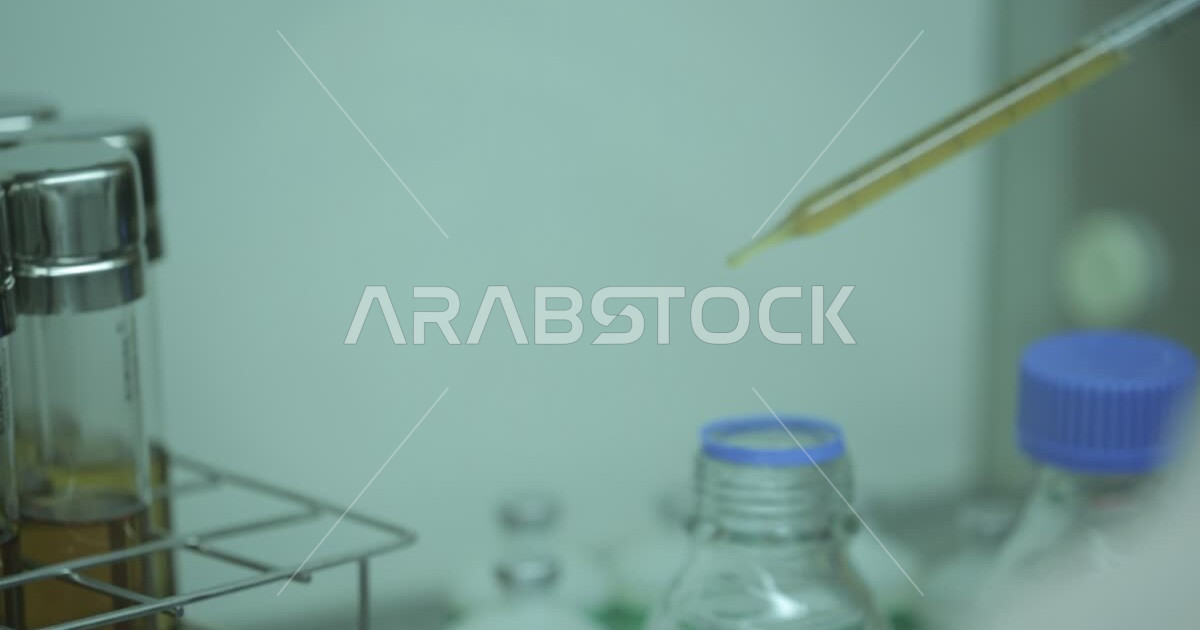 Saudi laboratory man, performing laboratory tests inside the laboratory ...