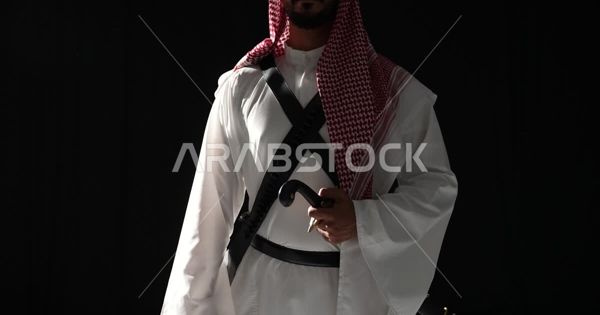 Portrait of a Saudi Arabian Gulf man wearing the traditional Saudi folk ...