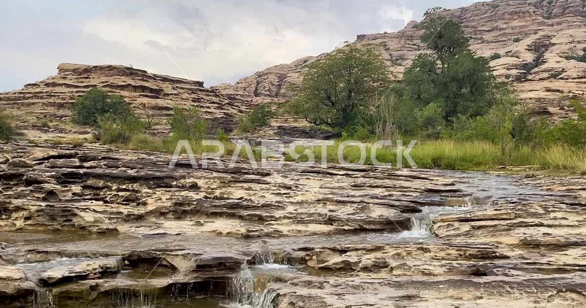 Running water in Al Rabu’a, Asir, Saudi Arabia, water between the rocks ...