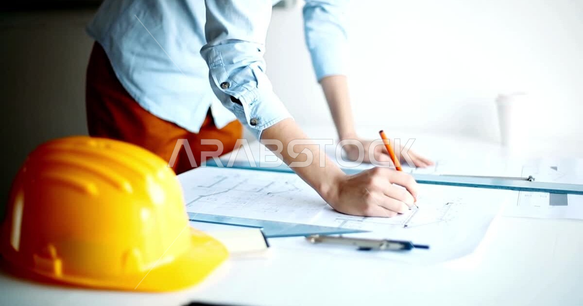 Architect planning a construction project, planning and executing work ...