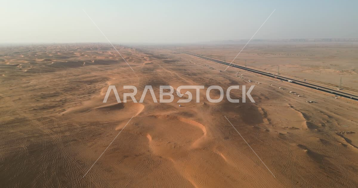 Drone photography of the highway in the middle of the desert, traffic ...