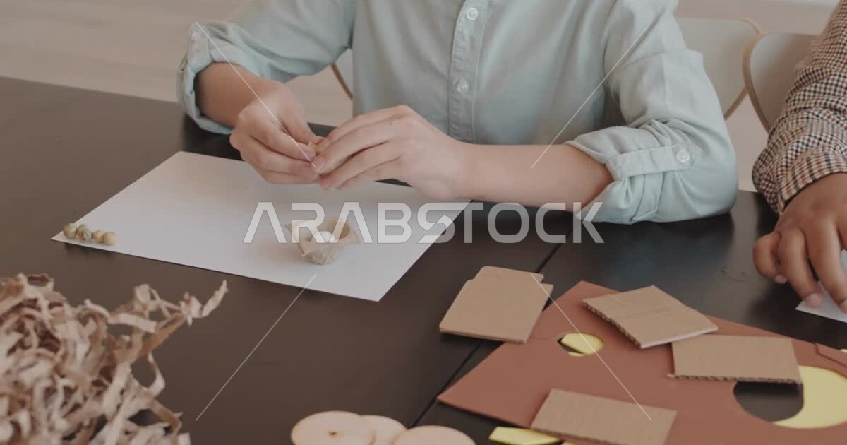 A group of children doing some work and handicrafts, art and creativity ...