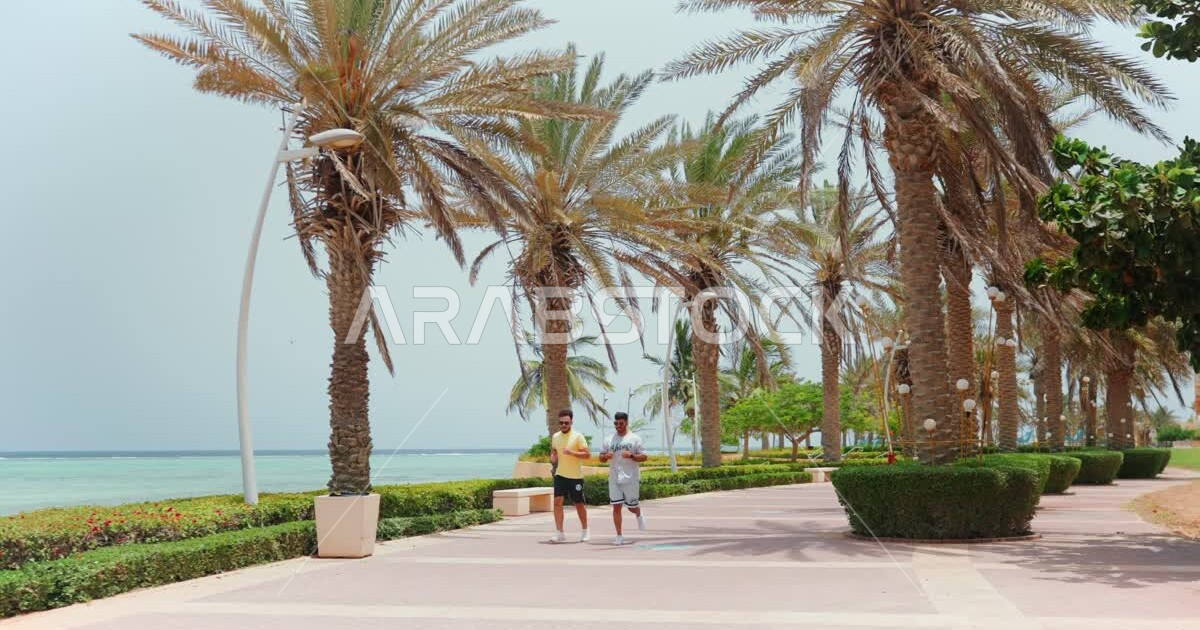 Two Saudi Arabian Gulf friends practicing running, health and fitness ...