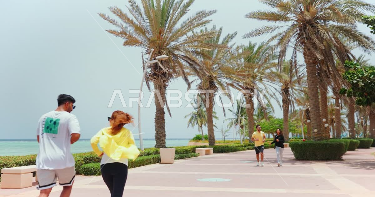 A Saudi Arabian Gulf man and woman practicing jogging, health and ...