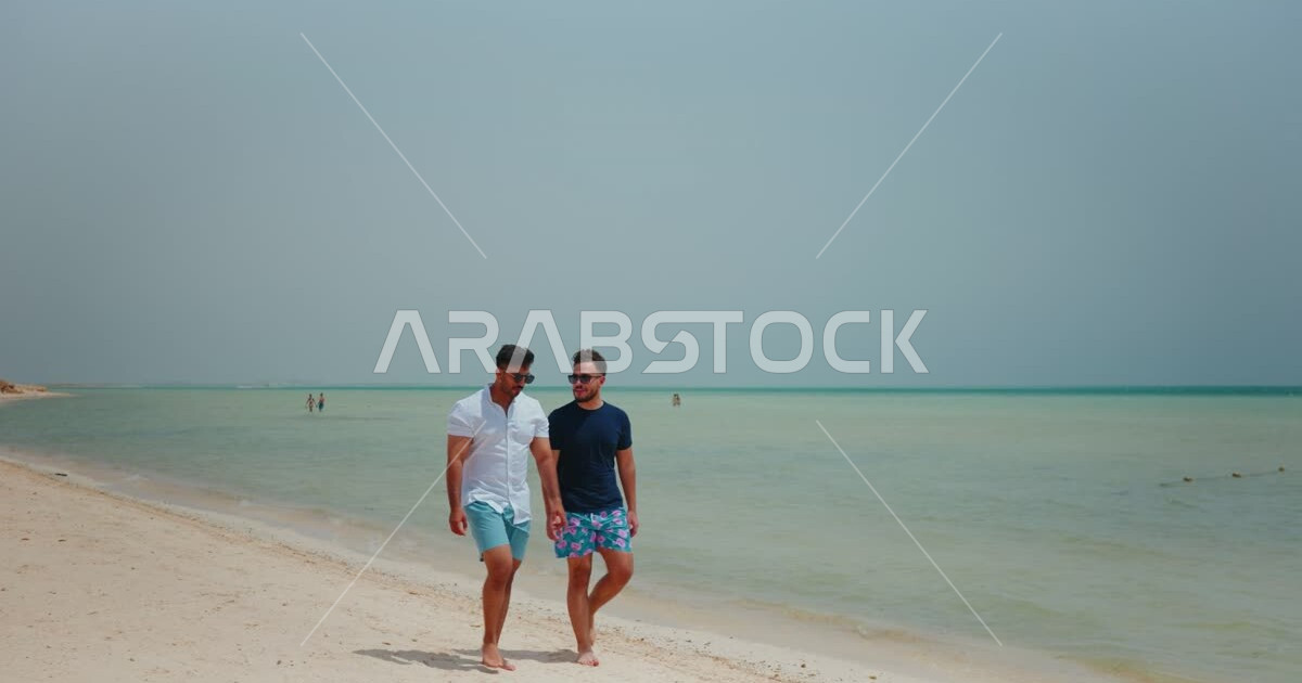 Two Saudi Arabian Gulf friends enjoying their summer vacation on the ...