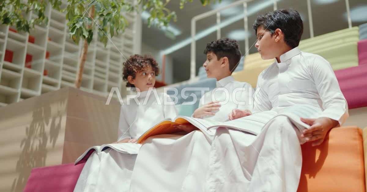 A group of Saudi Arabian Gulf students sitting on the stairs in the ...