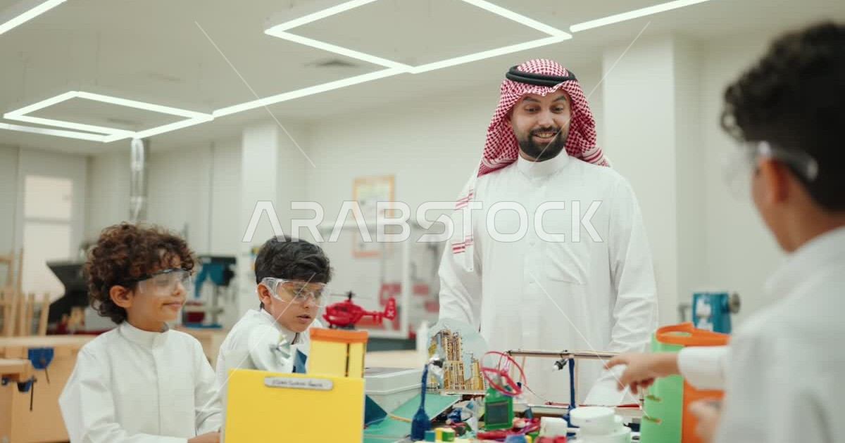 A Saudi Arabian Gulf teacher with his students in an advanced ...
