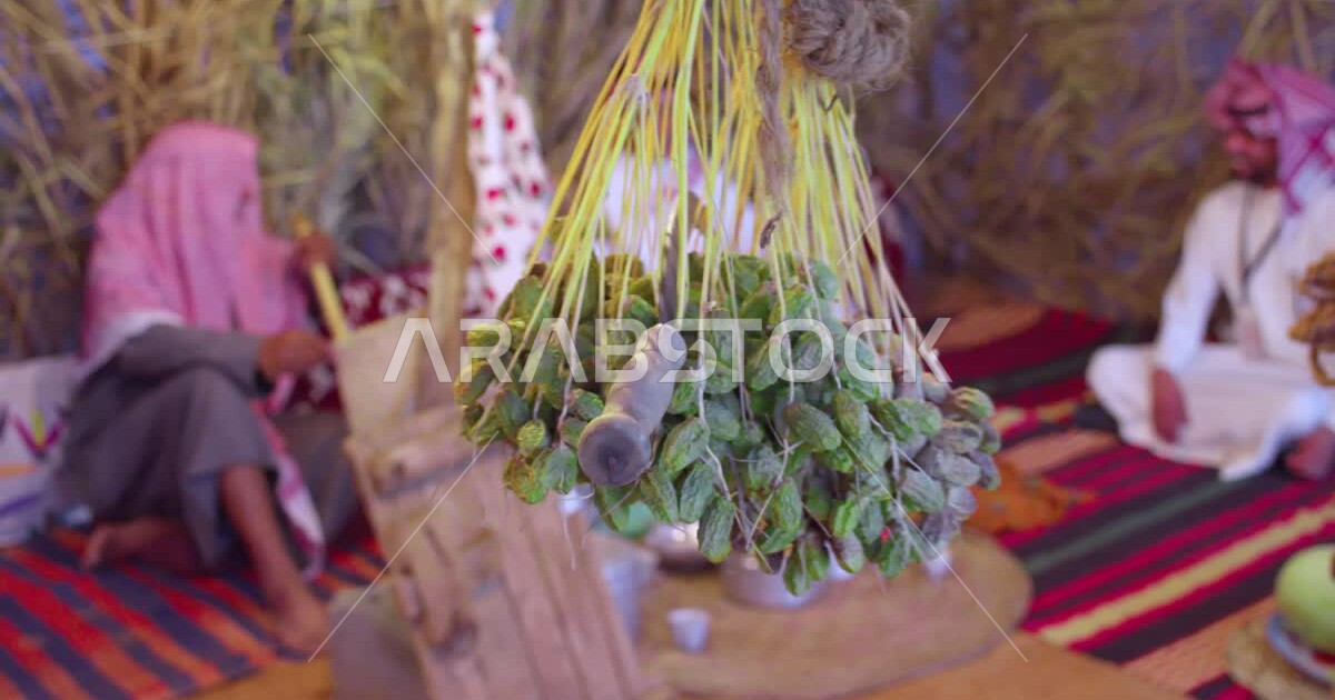 Close-up of a bundle of dates hanging in a popular tent, a traditional ...