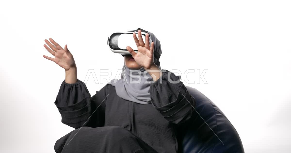 Chroma, a young Saudi Arabian Gulf woman, sitting on a chair, wearing ...