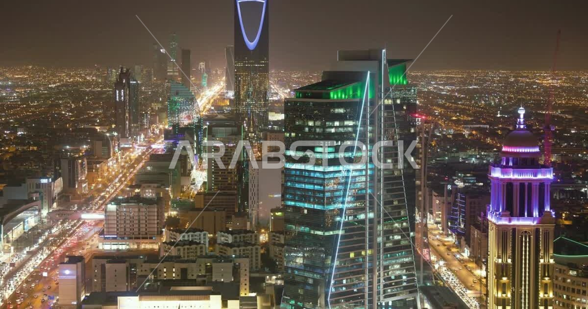 Night aerial photography of the Kingdom Tower in Riyadh, Saudi Arabia ...