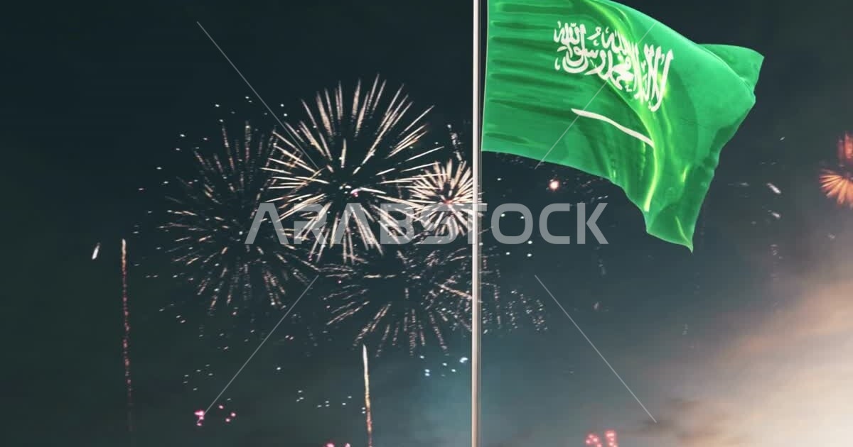 Fireworks in the sky of Saudi Arabia at night, the Saudi national flag ...