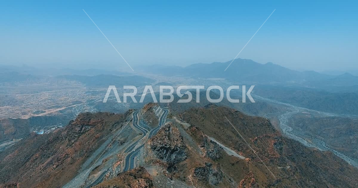 Aerial view of roads between mountains and valleys in the city of Taif ...