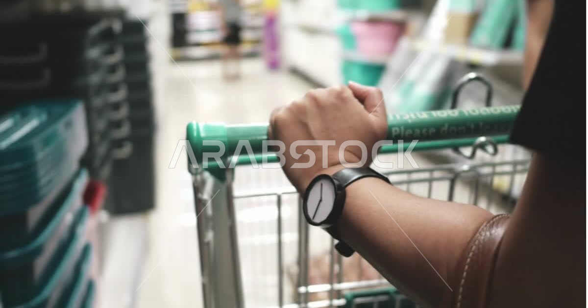 Close-up of a shopping cross full of goods, commercial stores, shopping ...