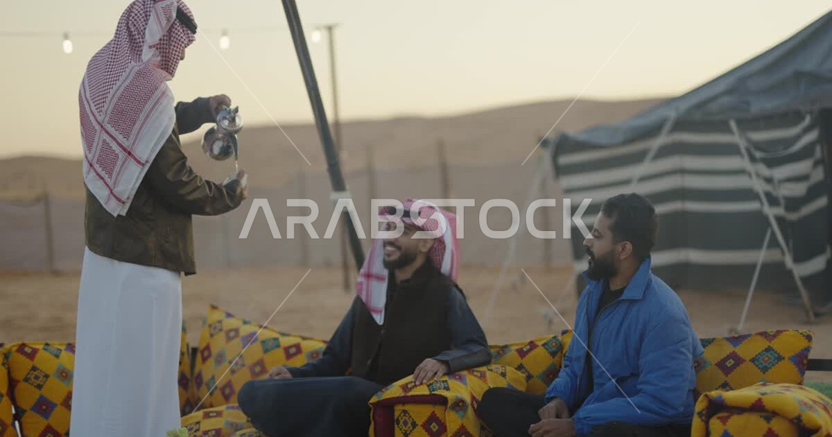 A group of Saudi Gulf Arab friends enjoying a road trip in the Saudi ...