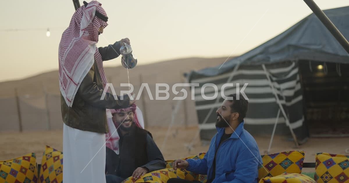 A group of Saudi Gulf Arab friends enjoying a road trip in the Saudi ...