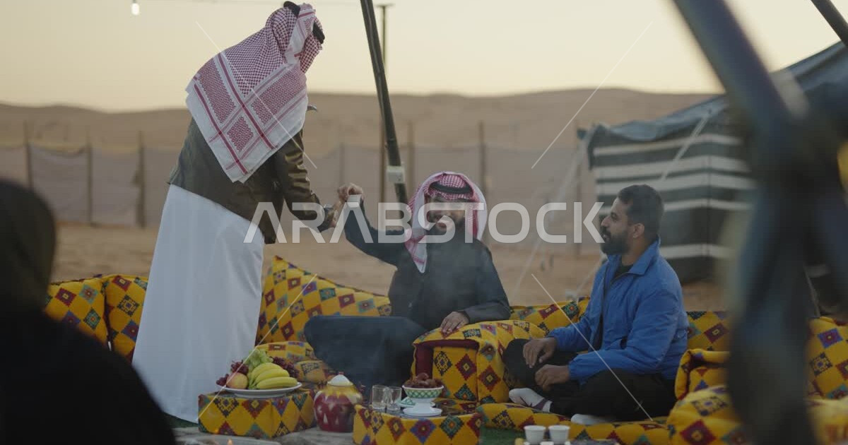 A group of Saudi Gulf Arab friends enjoying a road trip in the Saudi ...